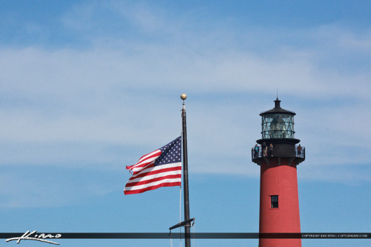 USA Flag with Big Red Jupiter Lighthouse May 2013 | Royal Stock Photo