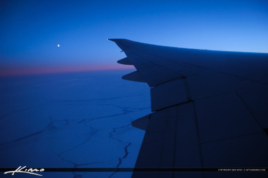 Moon Over the Artic from Airplane Window | Royal Stock Photo