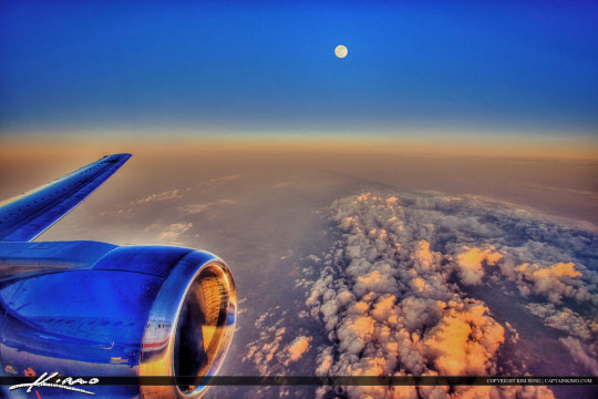 Airplane Window Fullmoon Clouds Flying Above Clouds | Royal Stock Photo