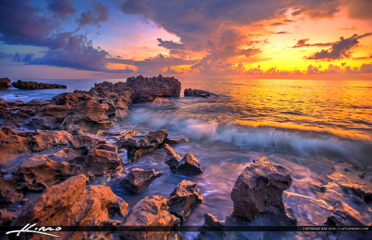 Wave Breaking Over Rocks at Beach Tequesta Florida | Royal Stock Photo