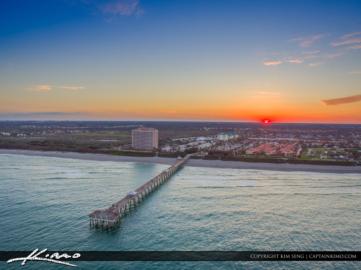 Juno Beach Pier Sunset from Ocean - Royal Stock Photo