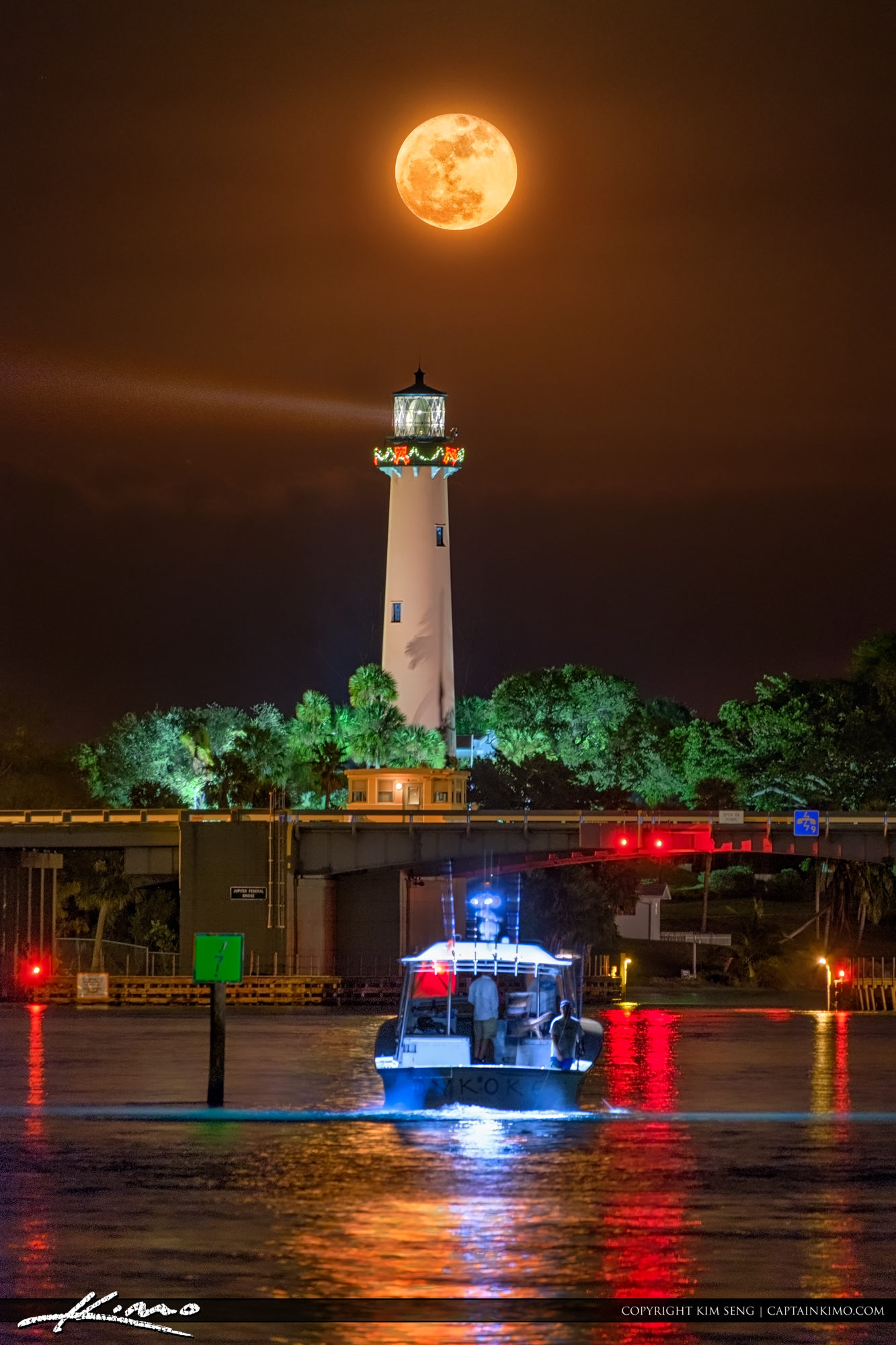 Fishing Boat and Moon Rise Jupiter Inlet Lighthouse | Royal Stock Photo