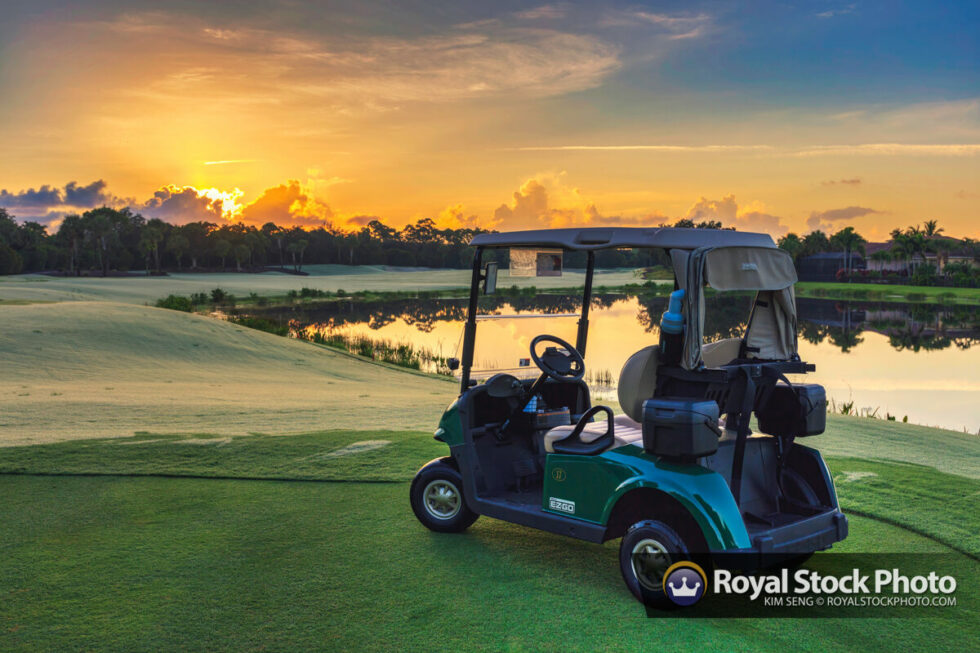 Golf Cart Sunset at Lake | Royal Stock Photo