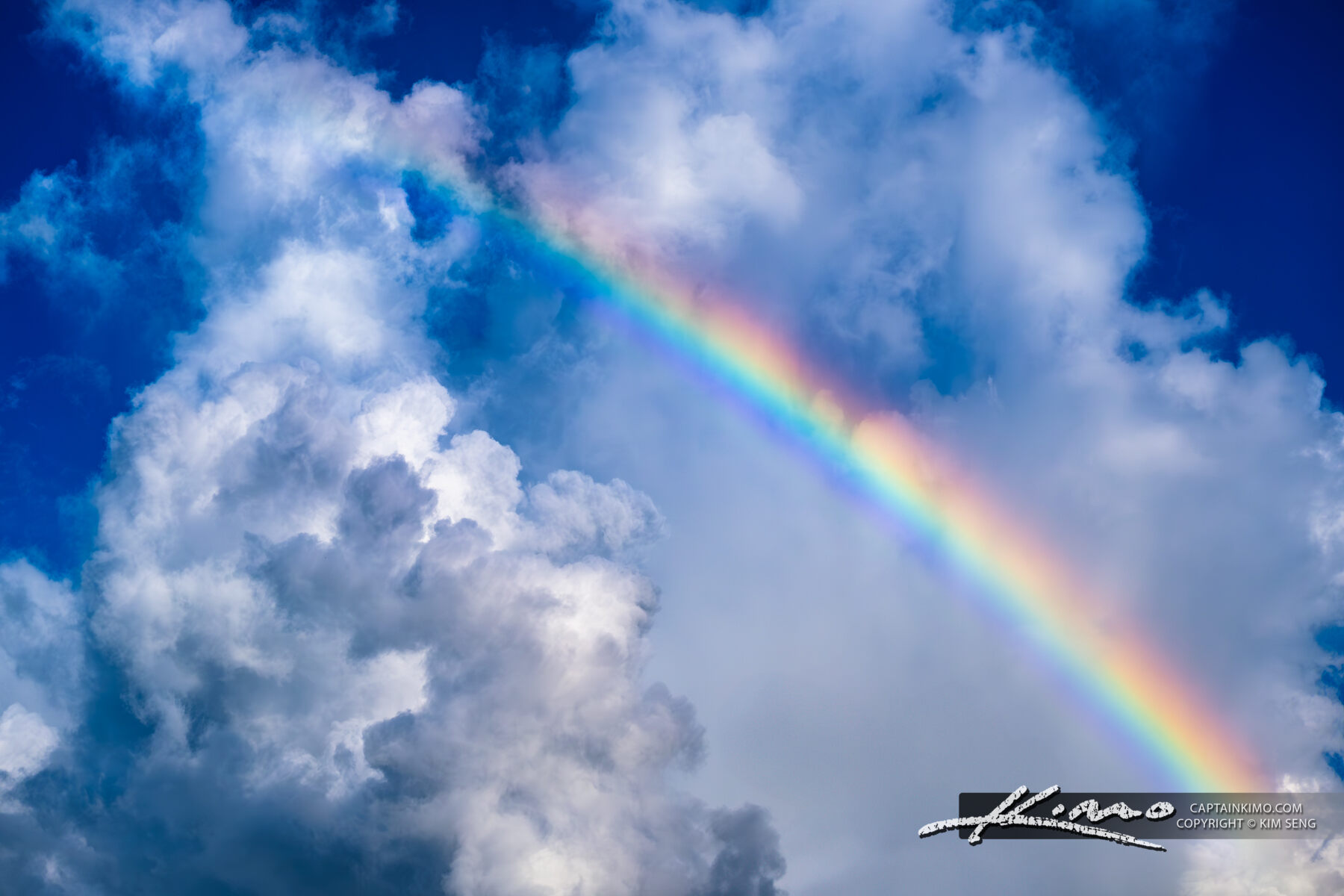 Rainbow Through Clouds Over Palm Beach Gardens | Royal Stock Photo