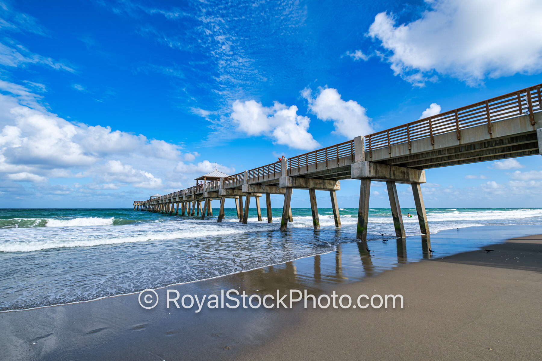 Juno Beach Pier Blue Sky and Water - Royal Stock Photo