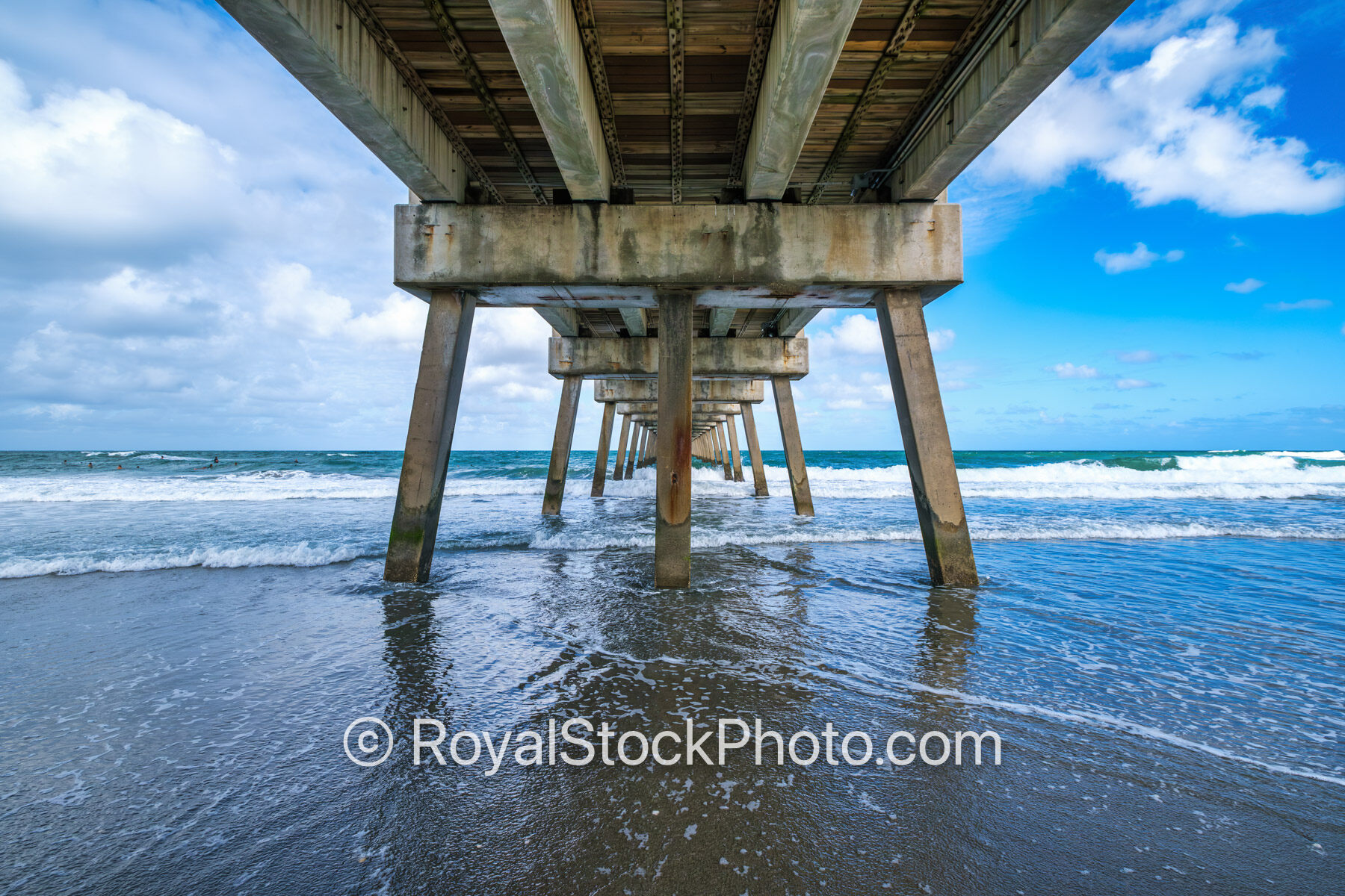 Underneath the Juno Beach Pier Blue Water | Royal Stock Photo