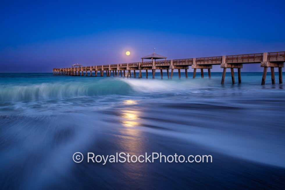 Juno Beach Pier Full Moon Rise April 2025 | Royal Stock Photo